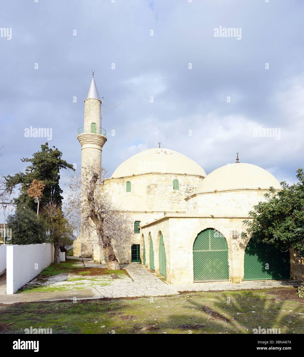 Hala Sultan Tekke. A mosque constructed from light-colored stone ...