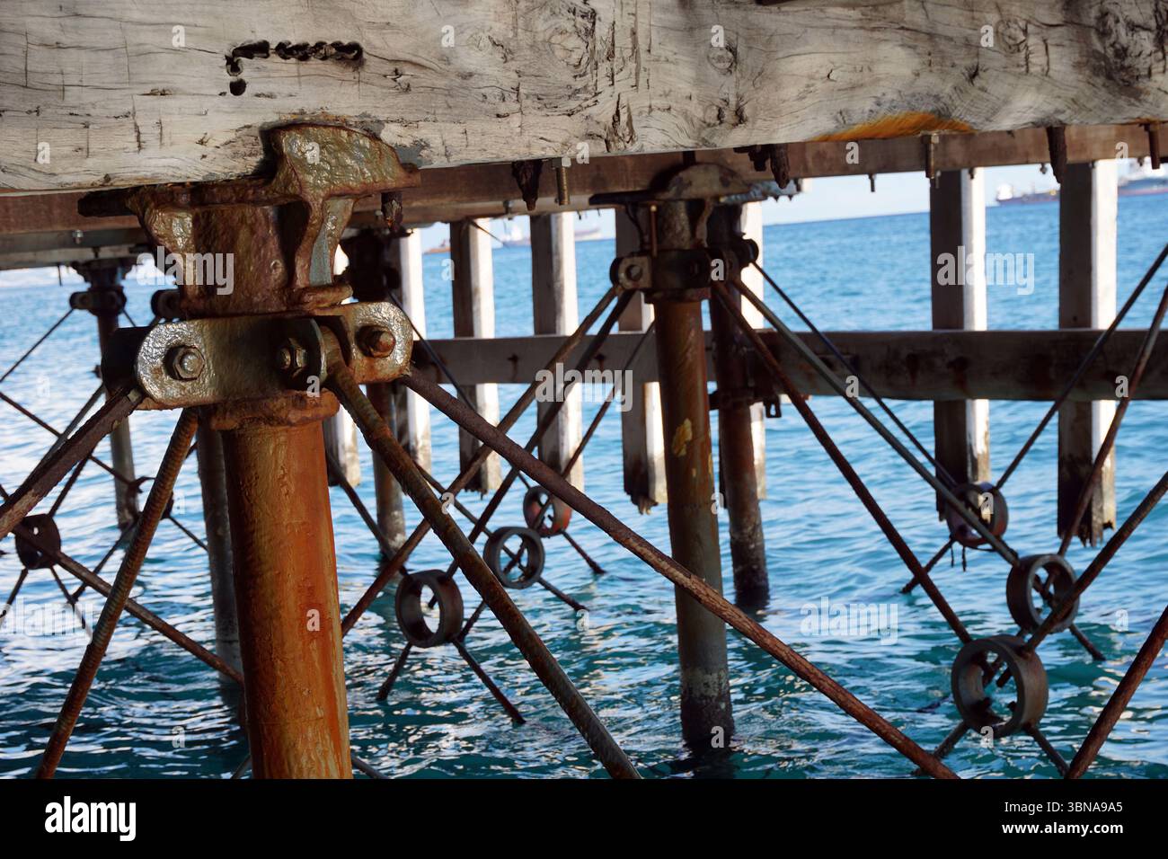 Limassol, Cyprus, A wooden pier extending into a tranquil blue ocean ...