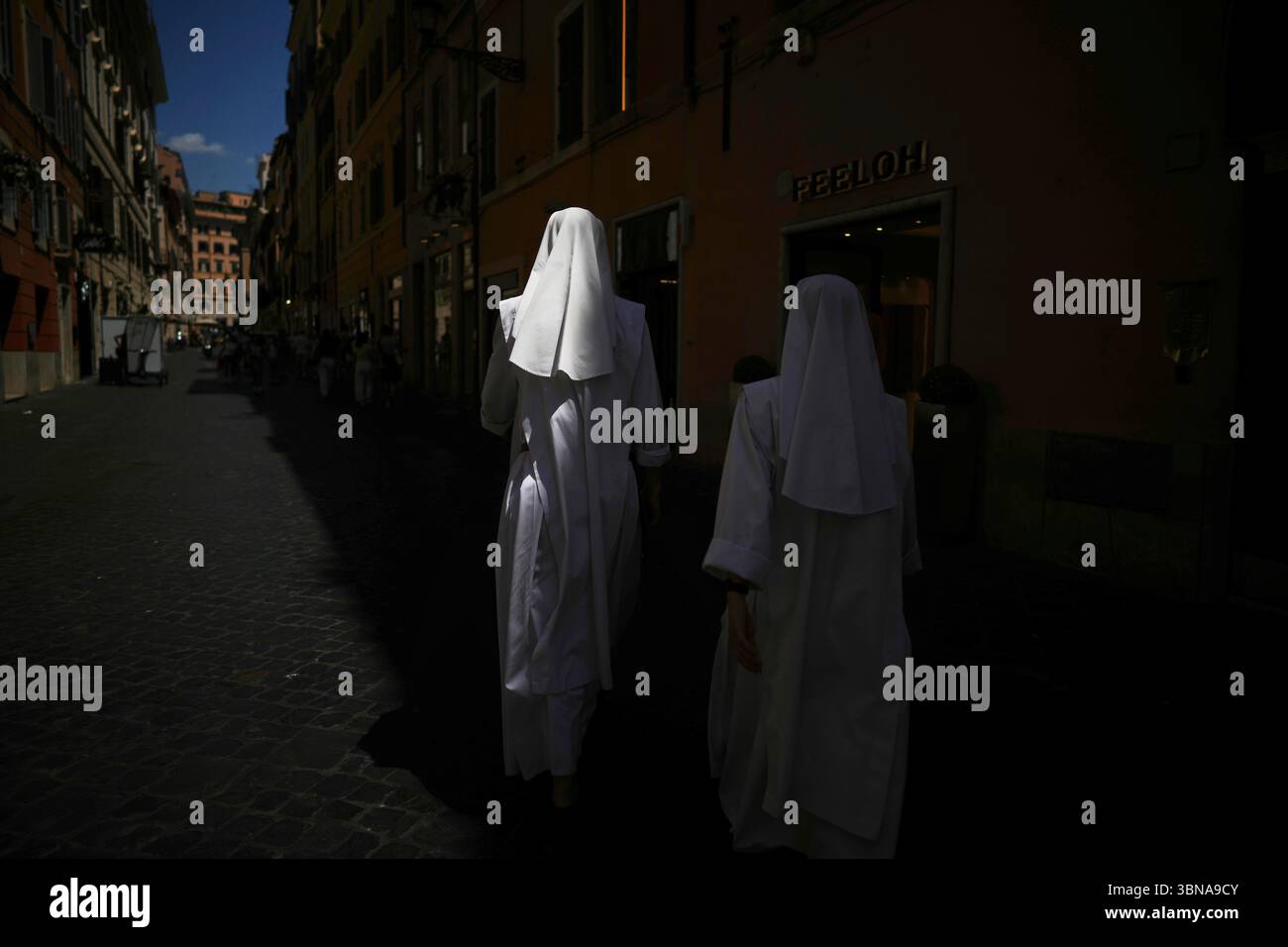 Two nuns walk in a street in downtown Rome, Tuesday, July 1, 2025. (AP ...
