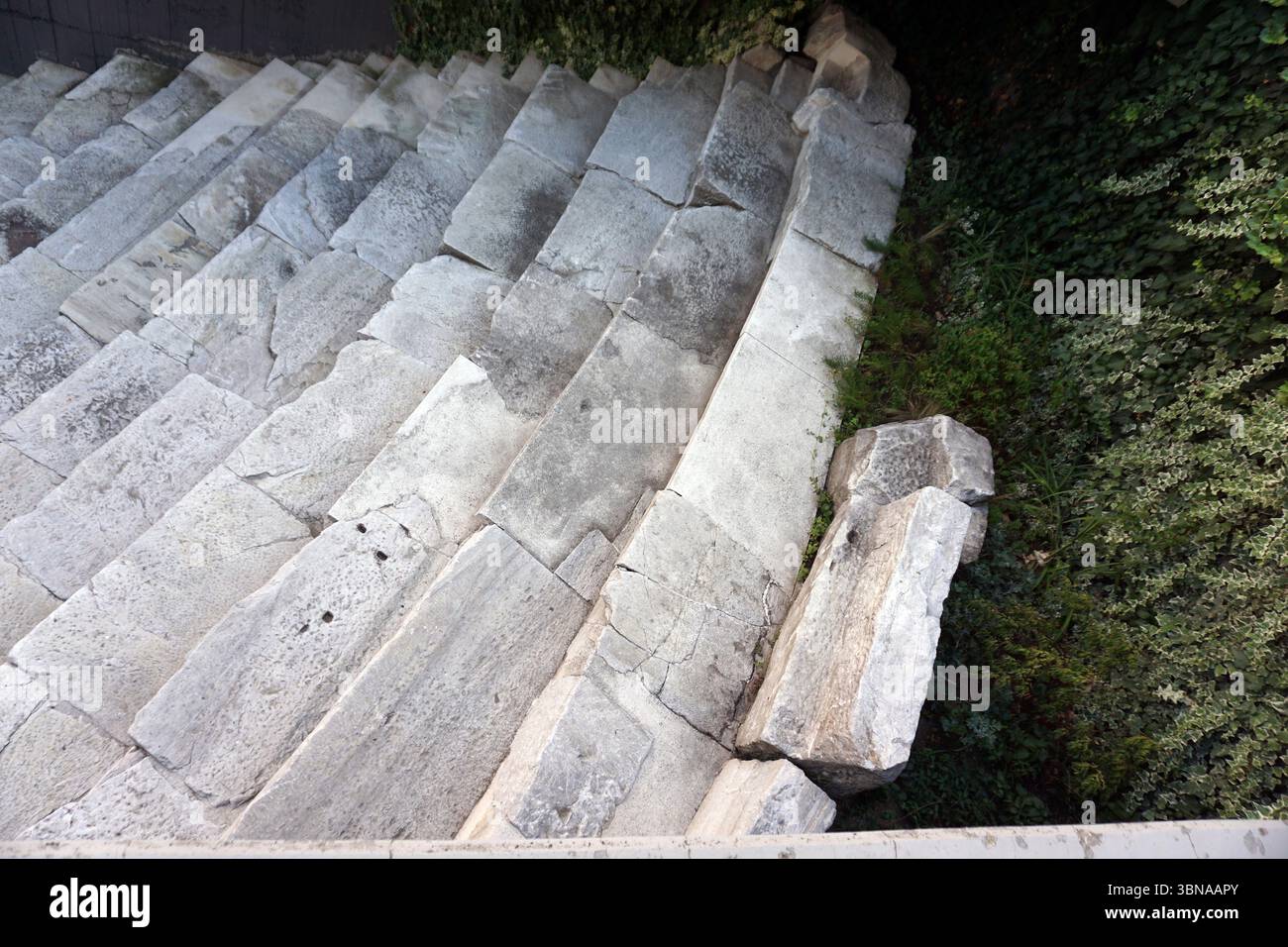 A set of stone stairs, likely part of a stone structure, with a ...