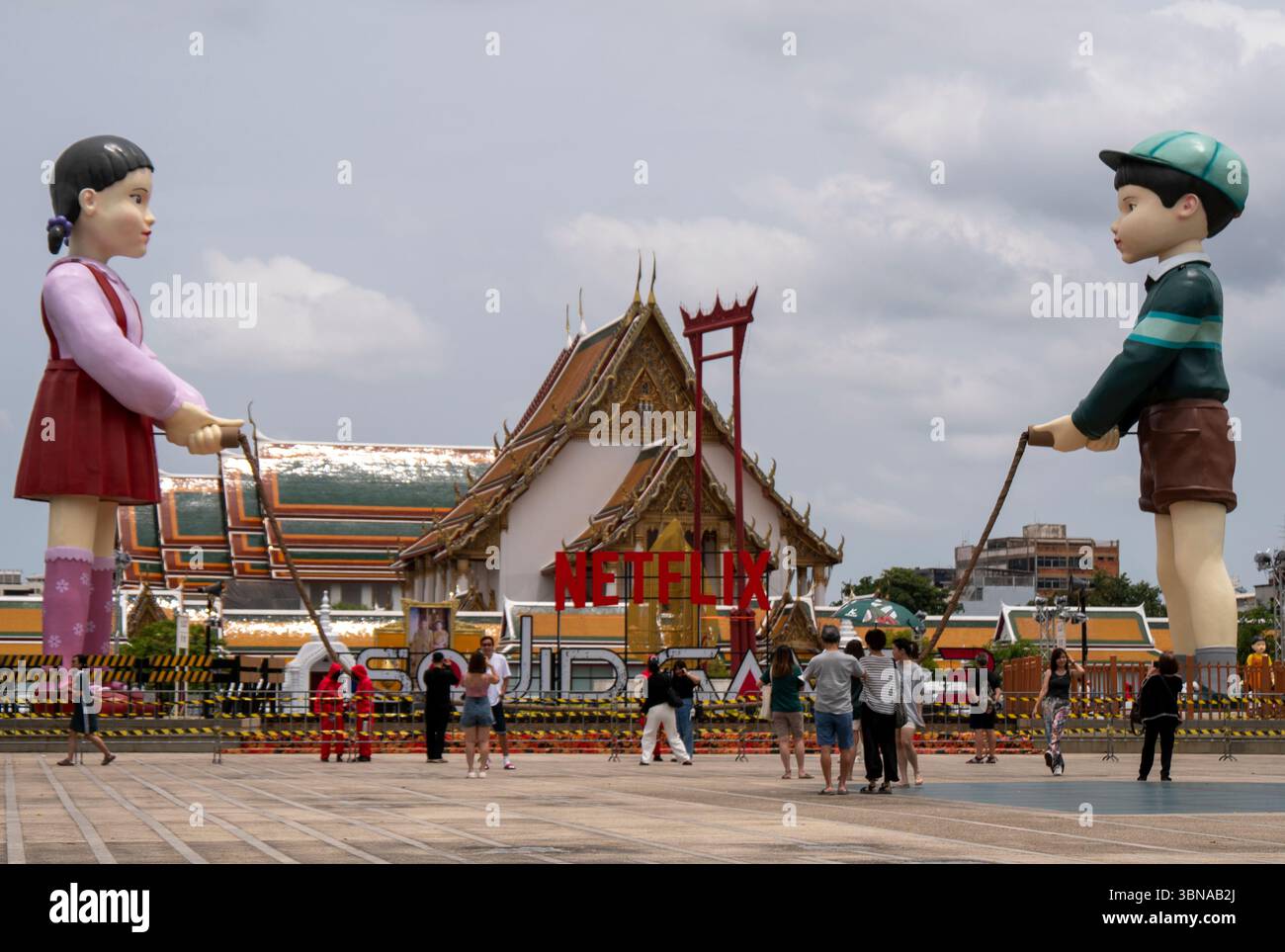 People poses for photographs in front of a 12 meter-tall statue of ...