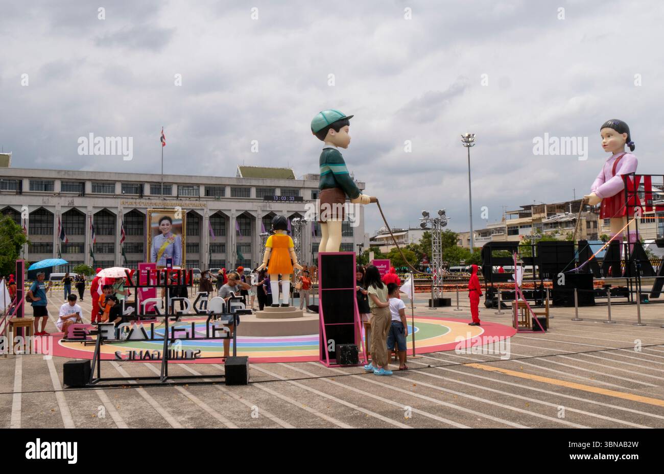 People play games near a 12 meter-tall statue of Young-hee and a 12 ...