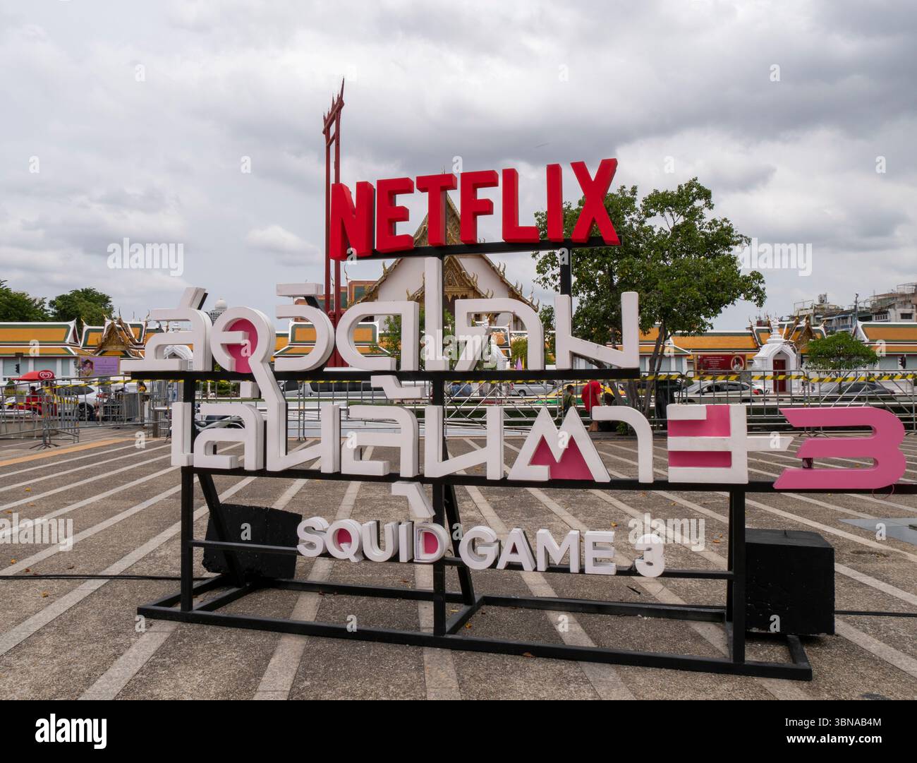 A sign from Netflix's series "Squid Game" stands on displayed for a ...
