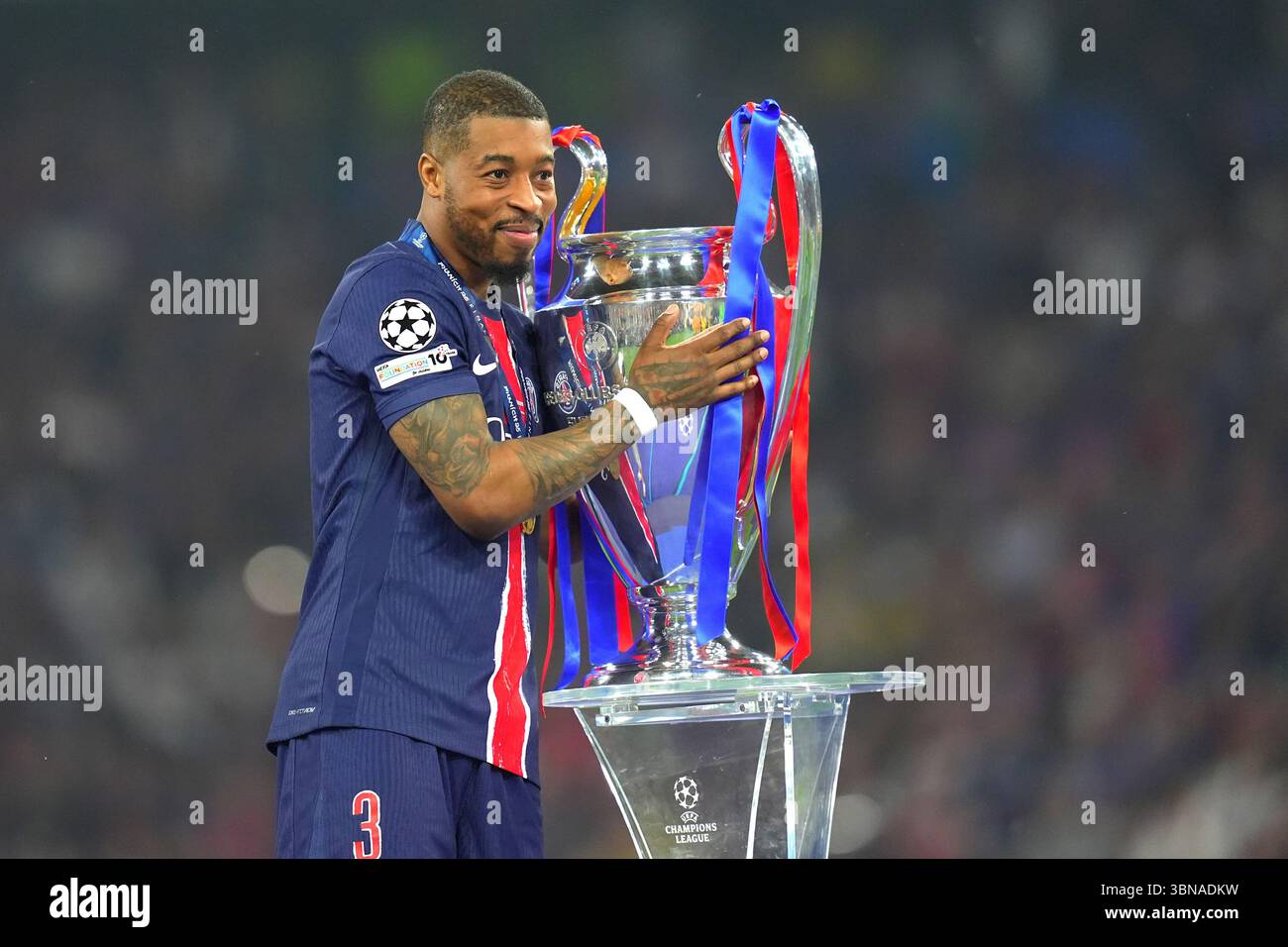 PSGÕs Presnel Kimpembe celebrates winning the trophy after the Uefa ...