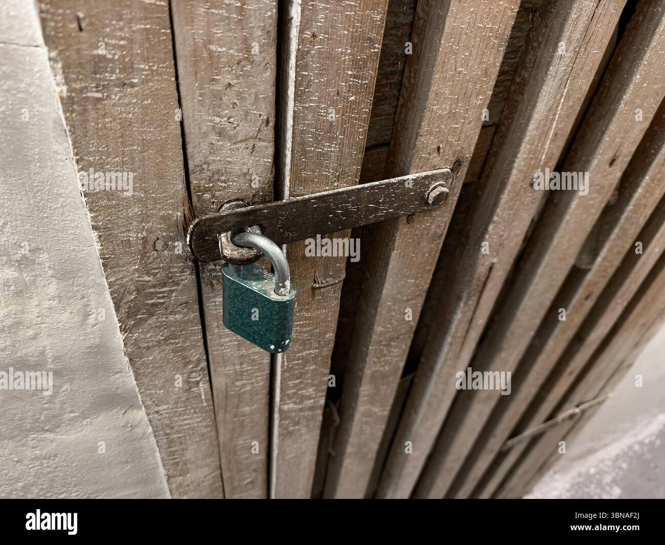 Closed old lock on wooden door in European house basement Stock Photo ...