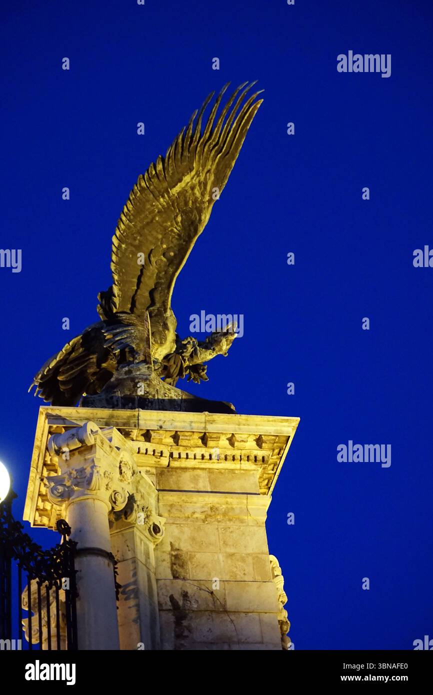 The Turul statue. A majestic bronze eagle statue perched atop a stone ...
