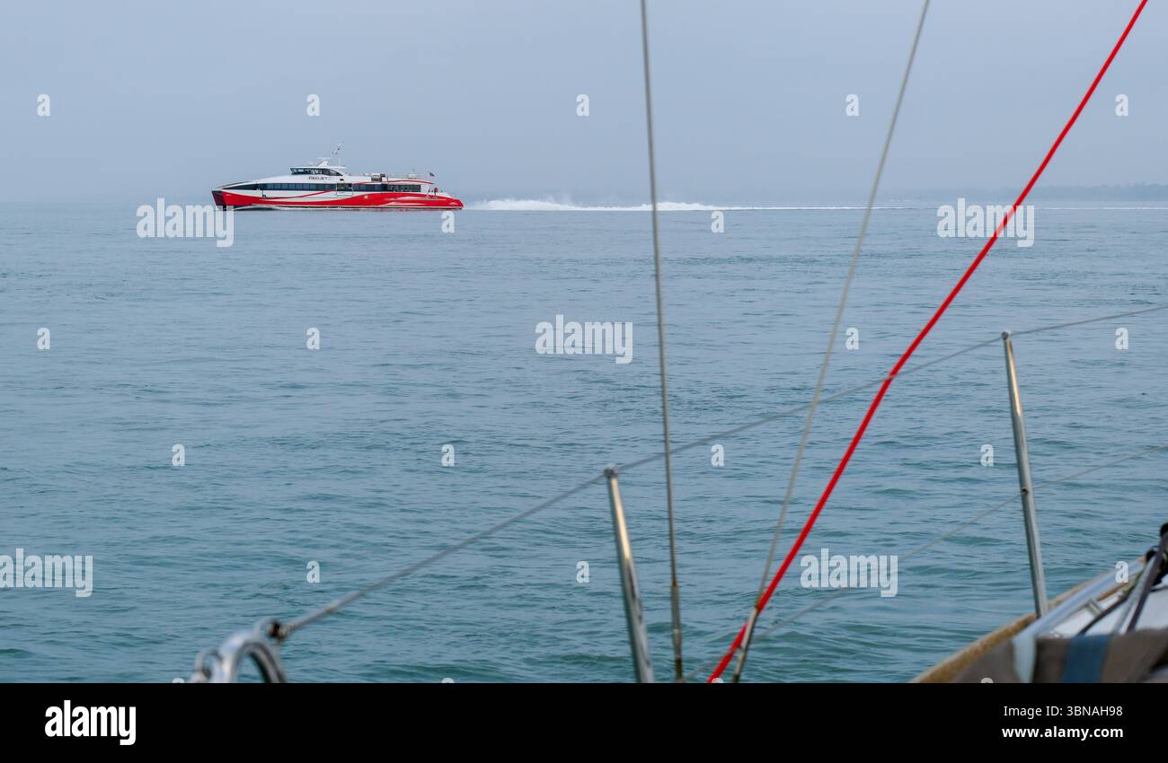 30 JUN 2025 - Isle of Wight, UK - Sailing a yacht in busy shipping ...