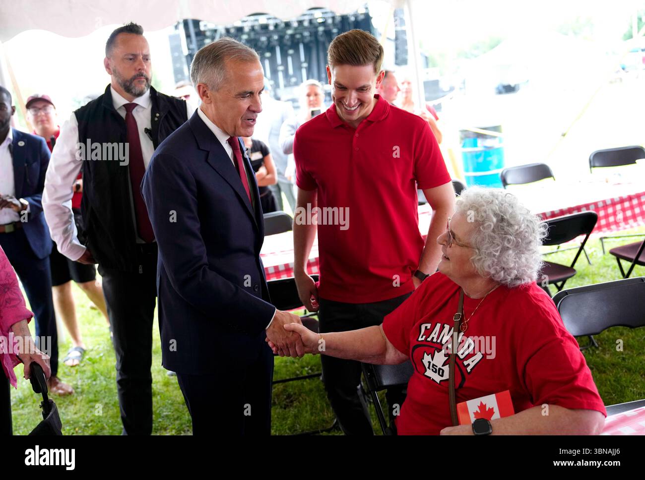 Prime Minister Mark Carney is joined by Ontario Liberal MPP Tyler Watt ...