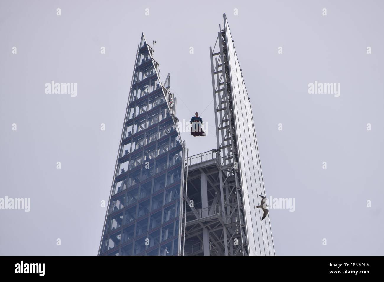 London, UK. 1st July 2025. Superman is suspended on top of The Shard ...