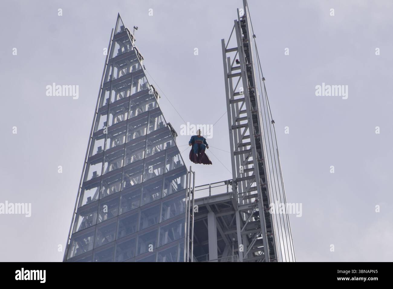 London, UK. 1st July 2025. Superman is suspended on top of The Shard ...
