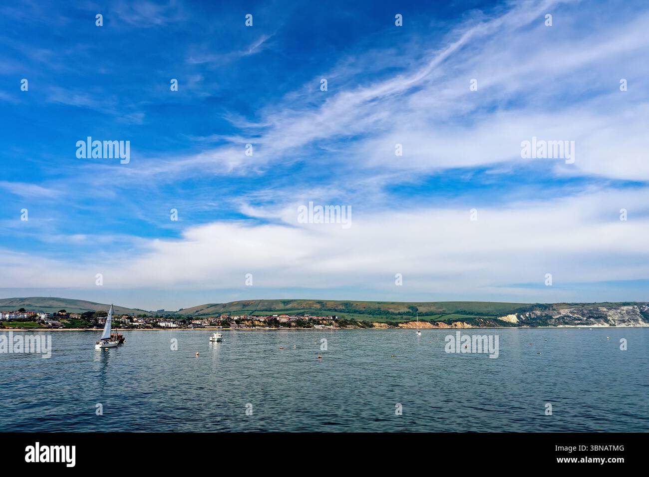 The view across Swanage bay, boats in foreground with the towns ...