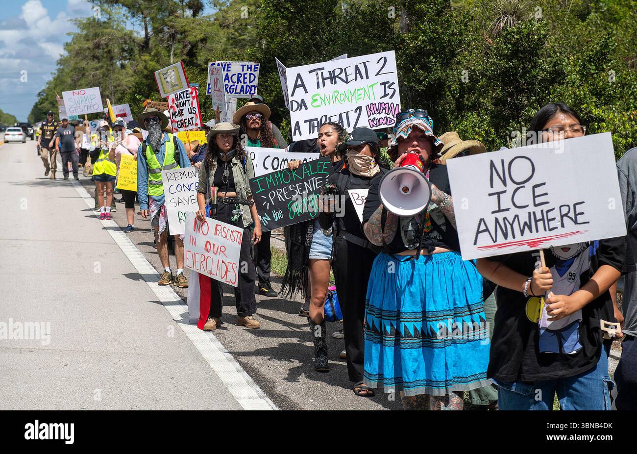 Protesters march outside the Dade-Collier Training and Transition ...