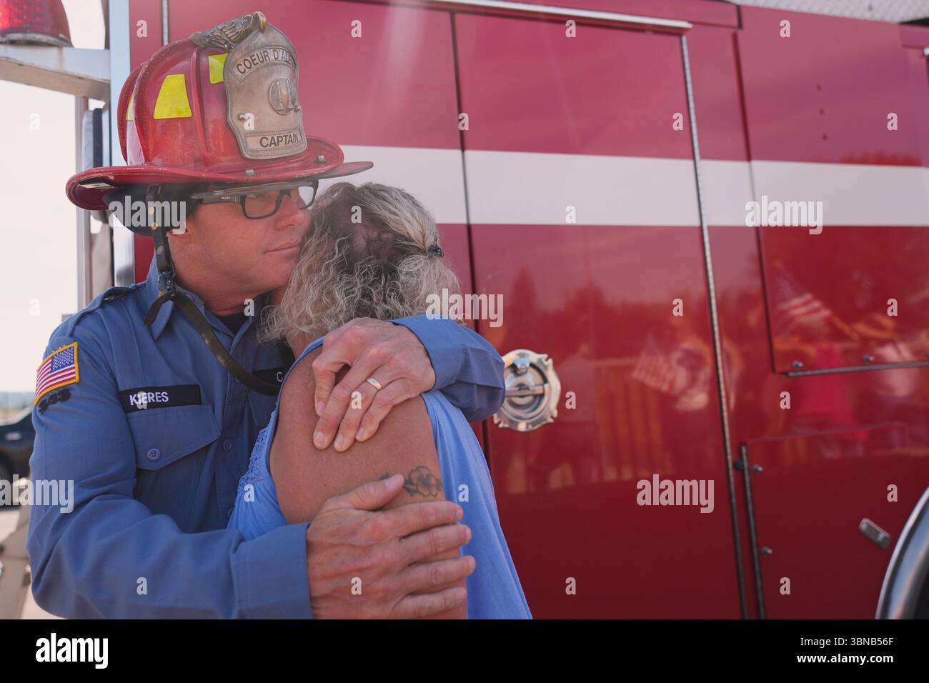 Kerry Kieres hugs her husband, Chris Kieres captain with Couer d'Alene ...