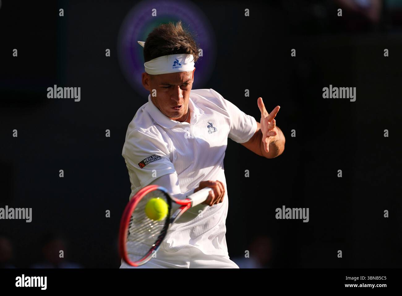 Sebastian Baez of Argentina returns the ball to Jack Draper of Britain ...