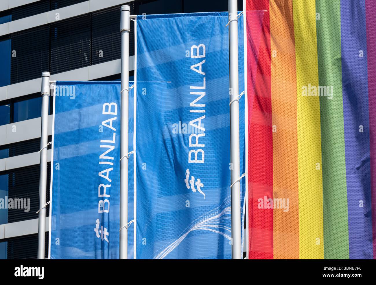 01 July 2025, Bavaria, Munich: A view of the company logo on flags in ...