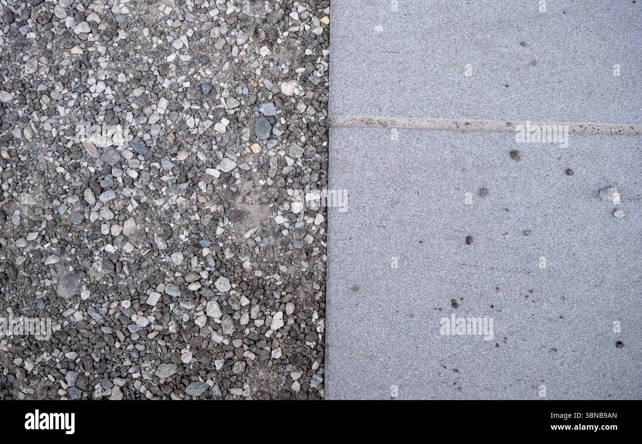 Contrast between crushed gravel and smooth concrete pavement surface ...