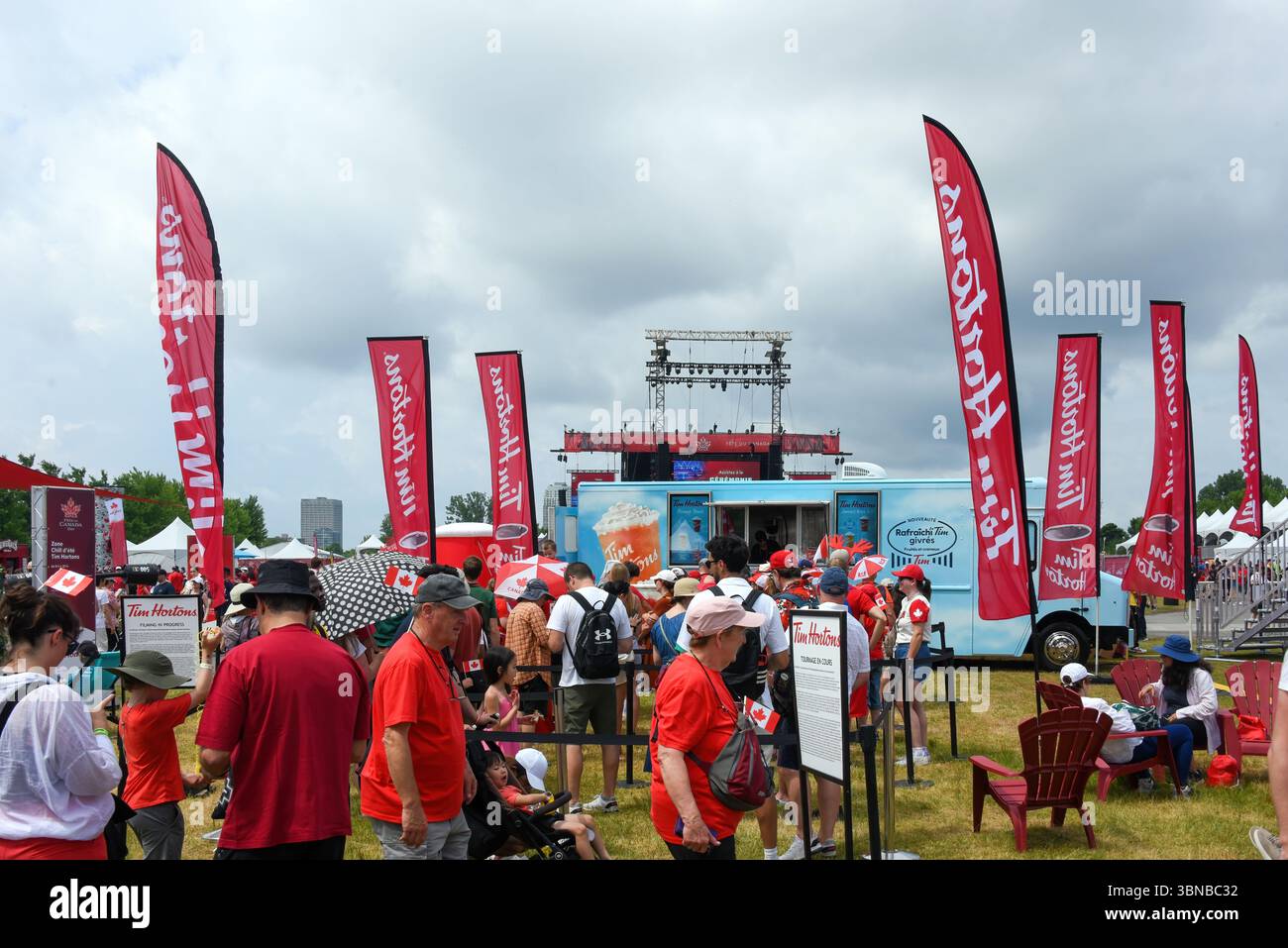 Ottawa, Canada - July 1, 2025: People line up for Tim Hortons truck at ...