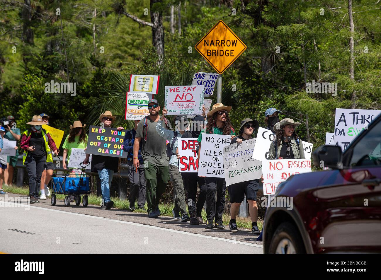 Protesters march outside the Dade-Collier Training and Transition ...