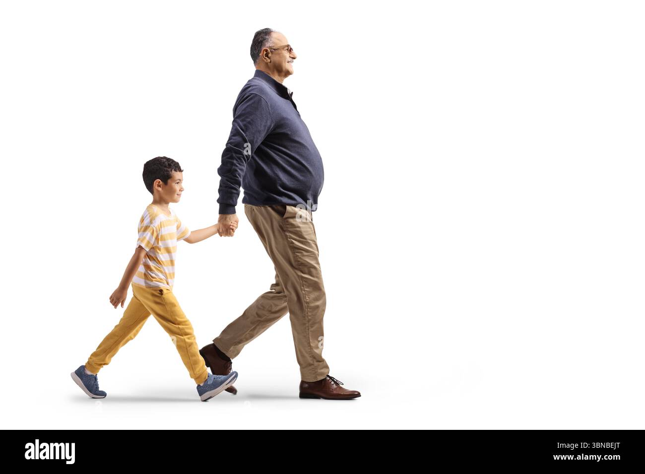Mature man and a kid walking together and holding hands isolated on ...