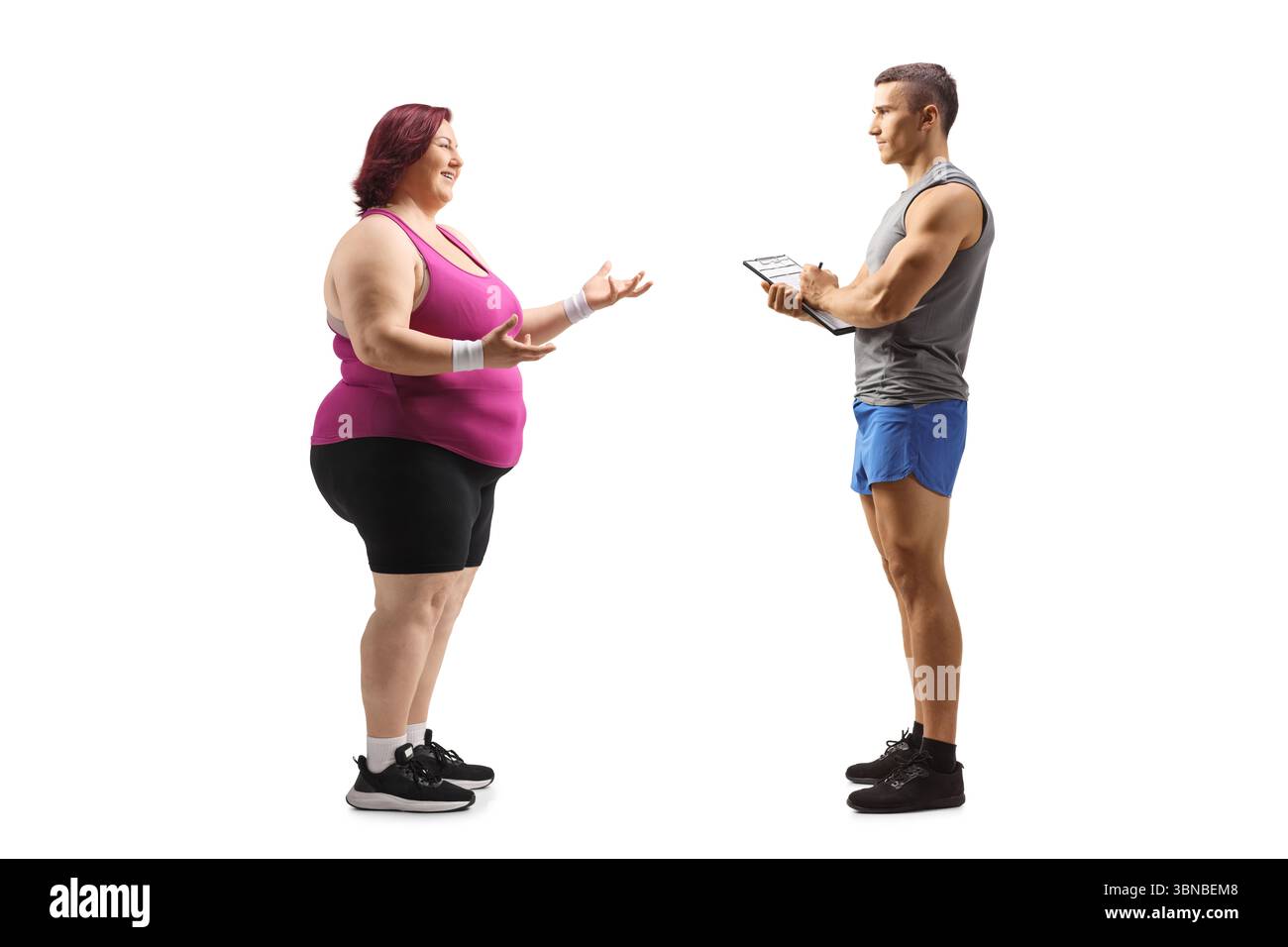 Full length profile shot of an overweight woman talking to a fitness ...