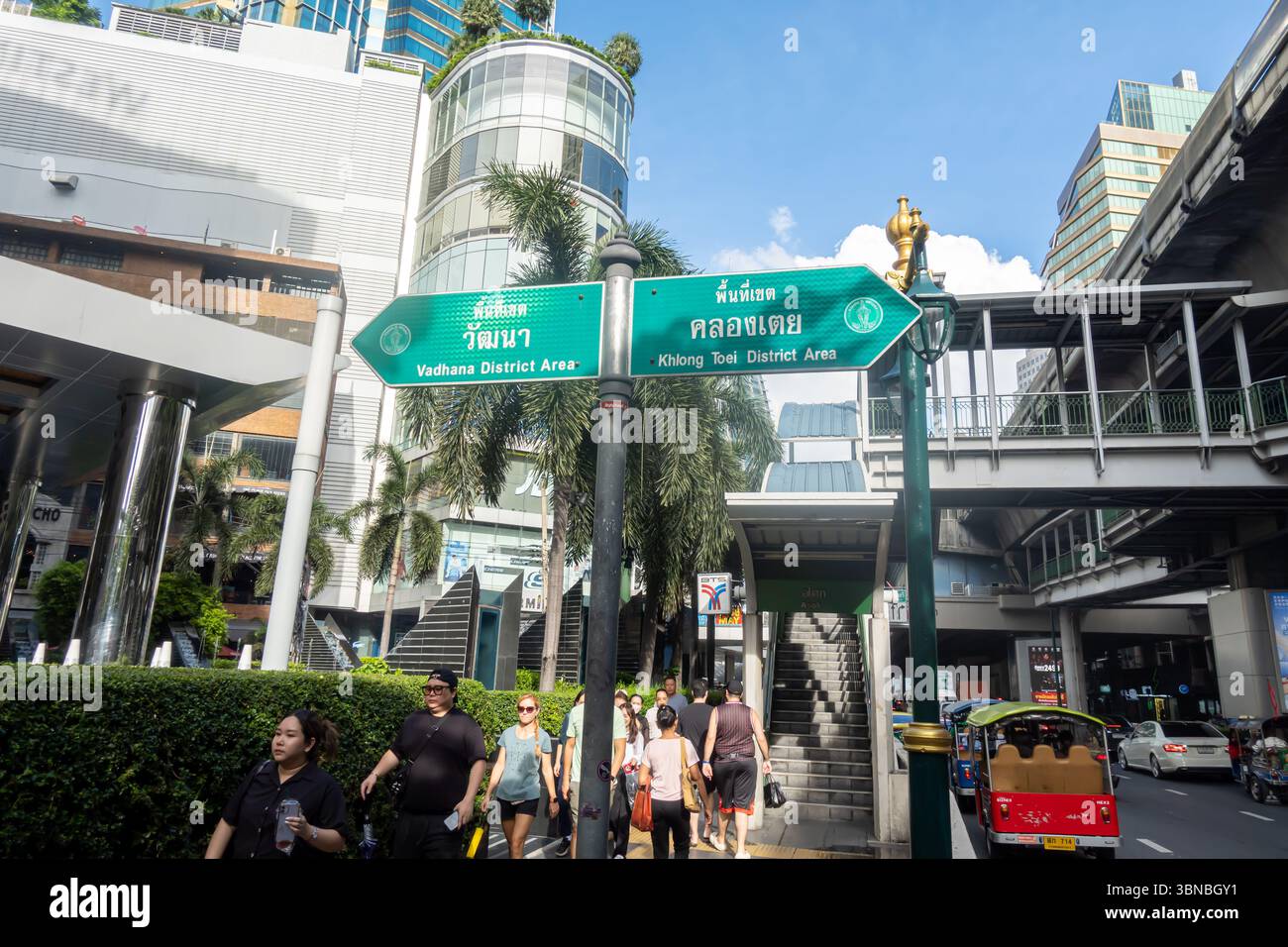 A street scene in Sukhumvit Road, Bangkok, Thailand, directional sign ...