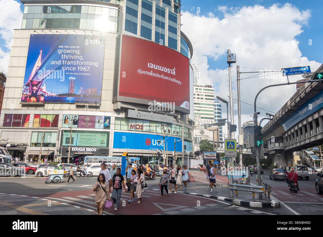 Pedestrians crossing street, Interchange 21 building, advertising ...
