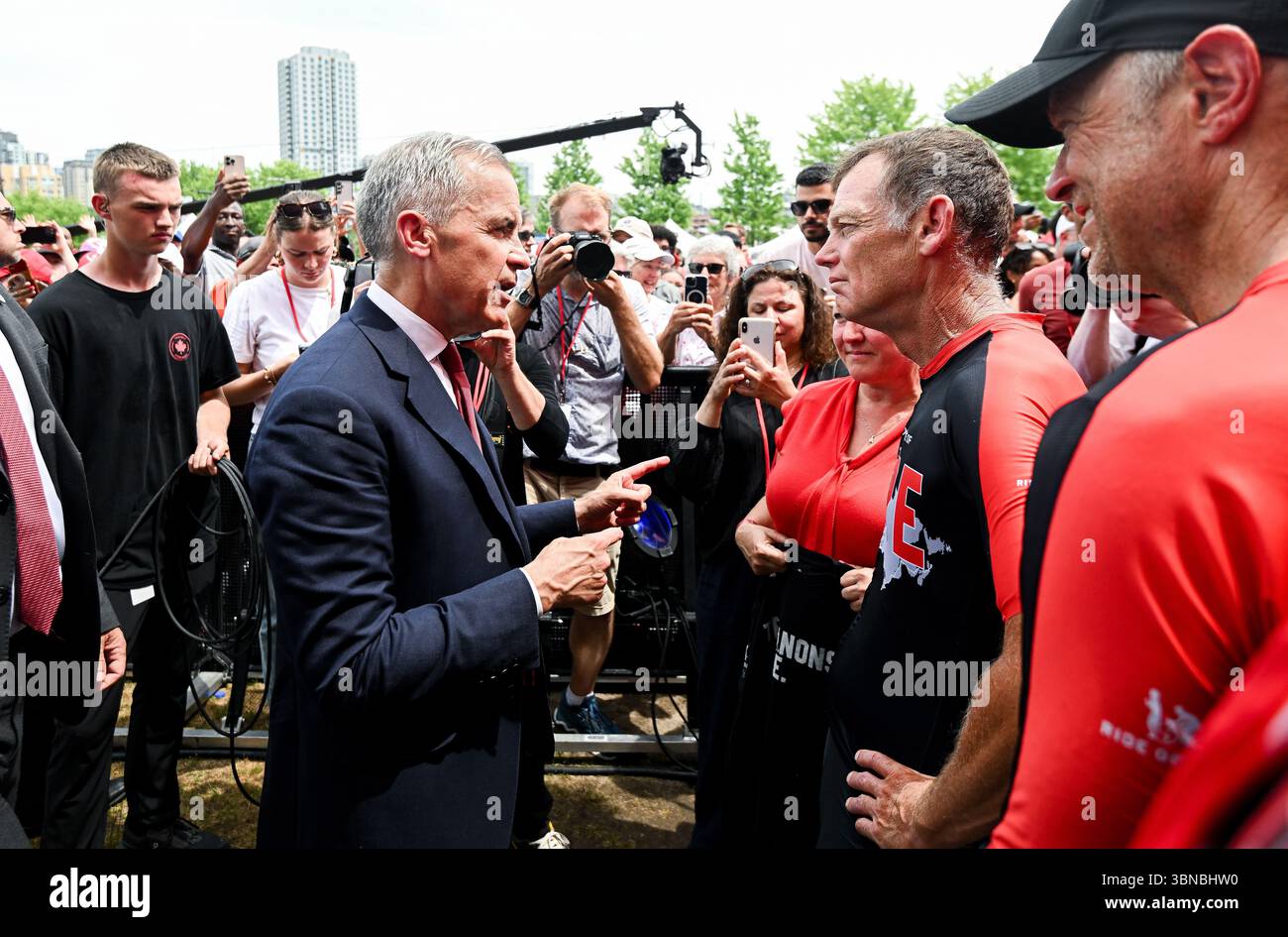 Ottawa, Canada. 01st July, 2025. Prime Minister Mark Carney, left ...