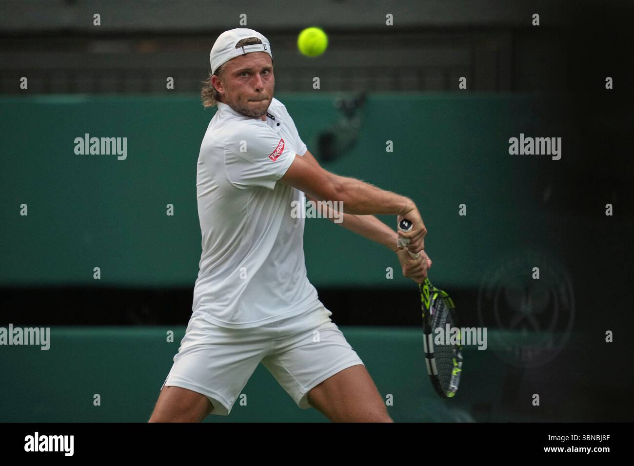 Alexandre Muller of France returns to Novak Djokovic of Serbia during ...