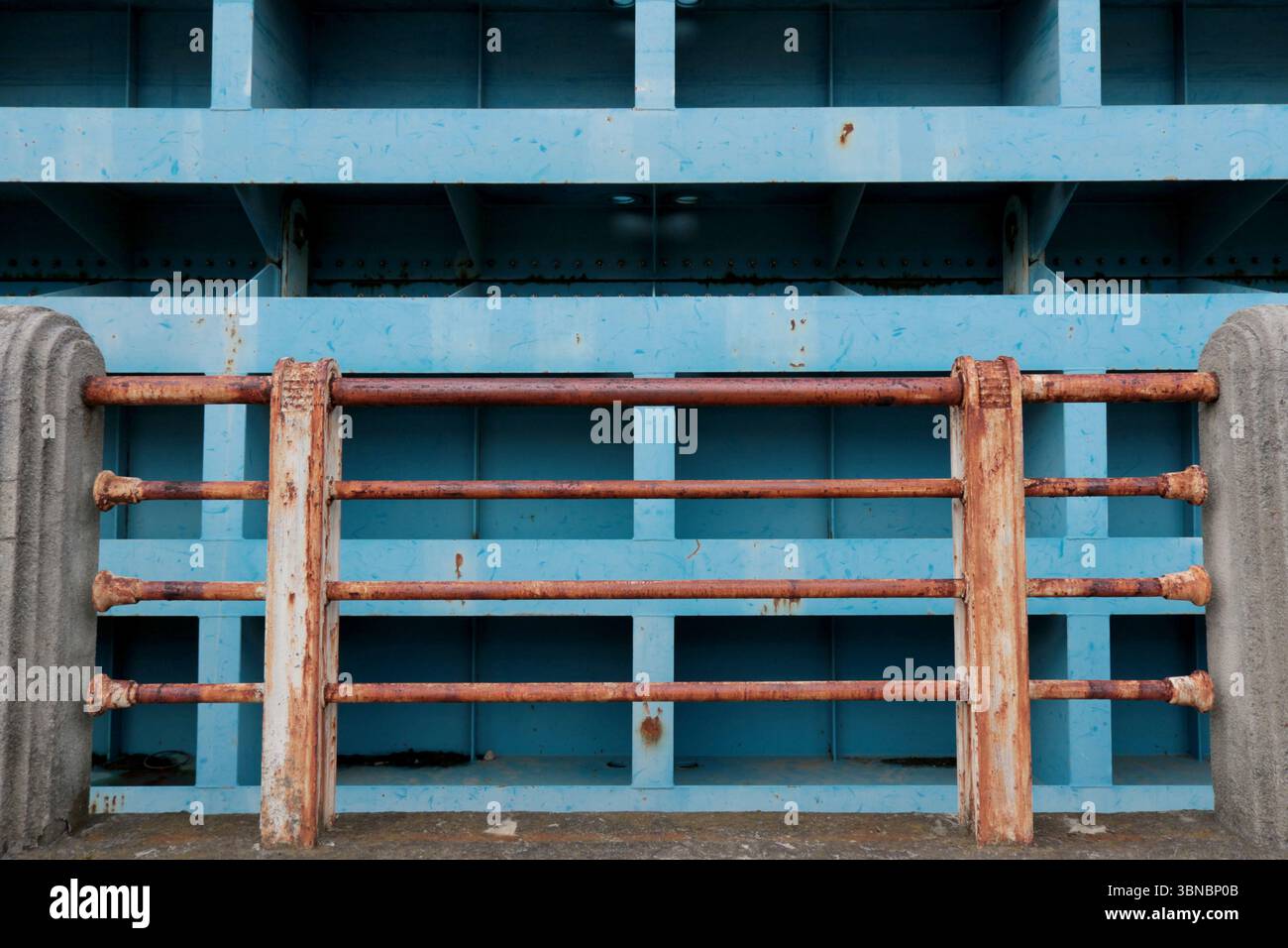 The bridge's massive steel main girders and the old rusty steel safety ...
