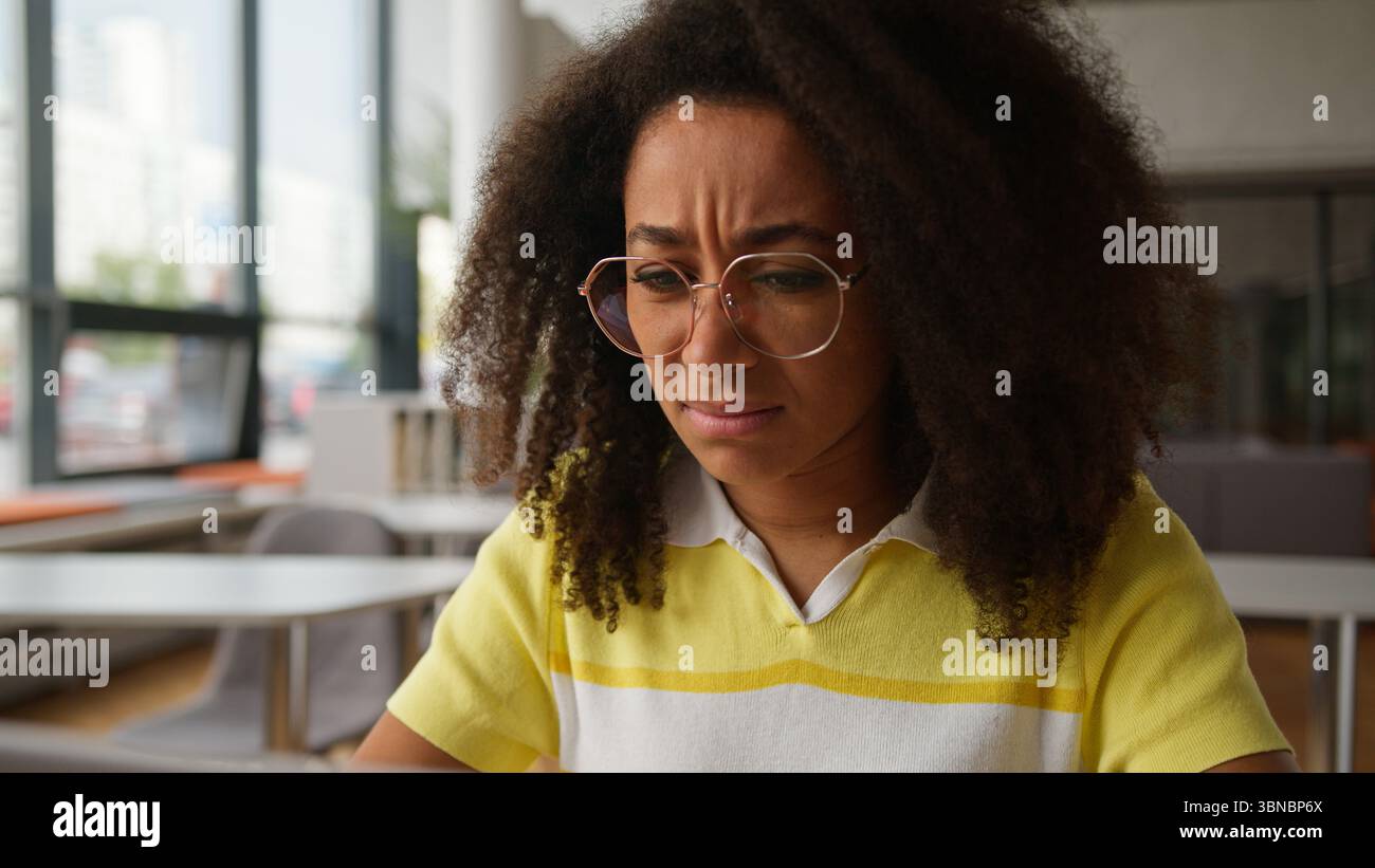 Confused shocked African American woman student girl ethnic female ...