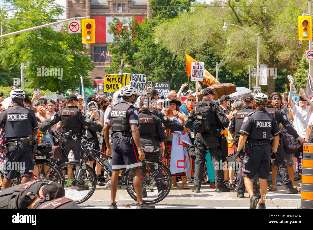 Toronto, Canada, 1 July 2025. Police face off against protesters near ...