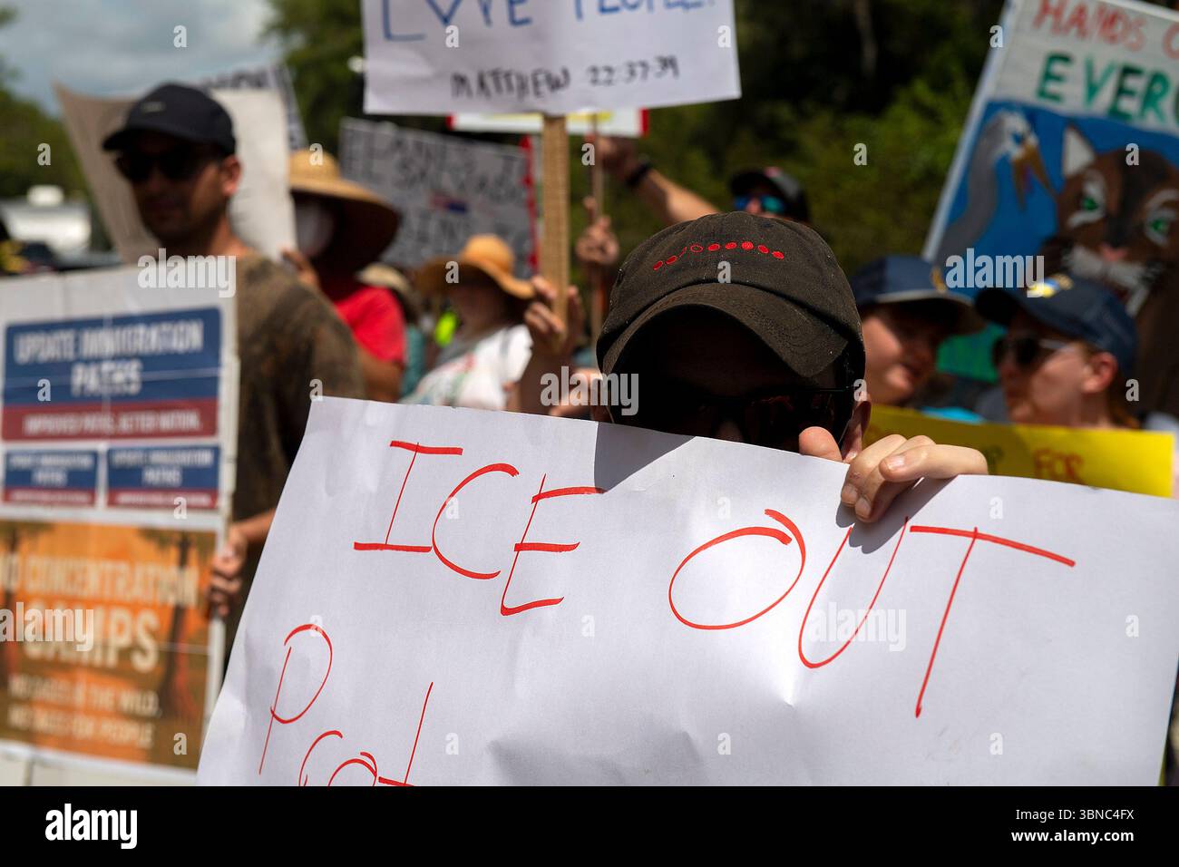 Protesters march outside the Dade-Collier Training and Transition ...