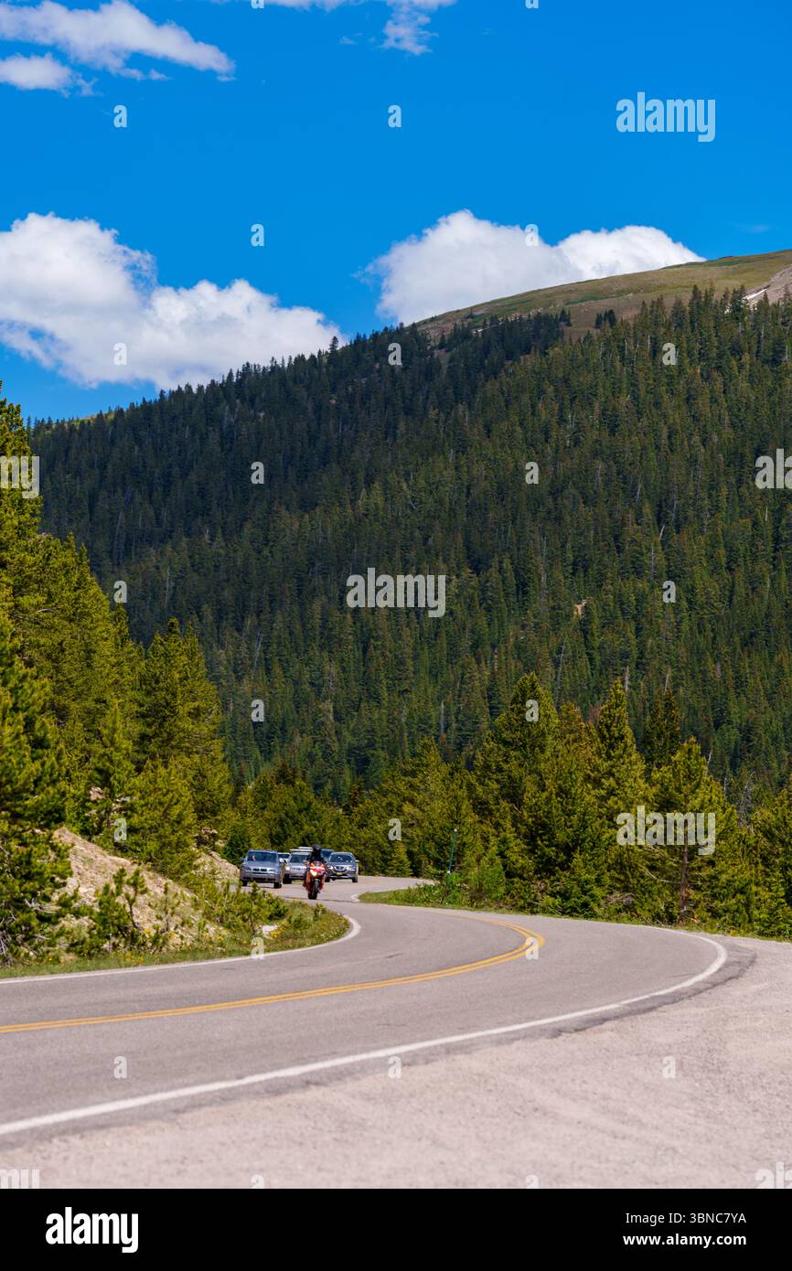Cars drive along Independence Pass Colorado on the twisty mountain ...