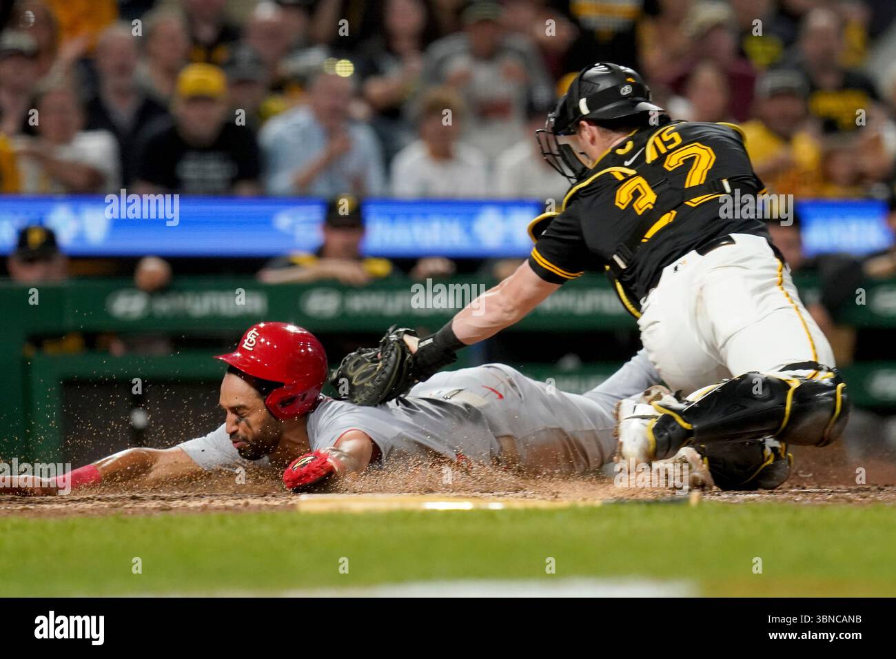Pittsburgh Pirates catcher Henry Davis, right, tags out St. Louis ...