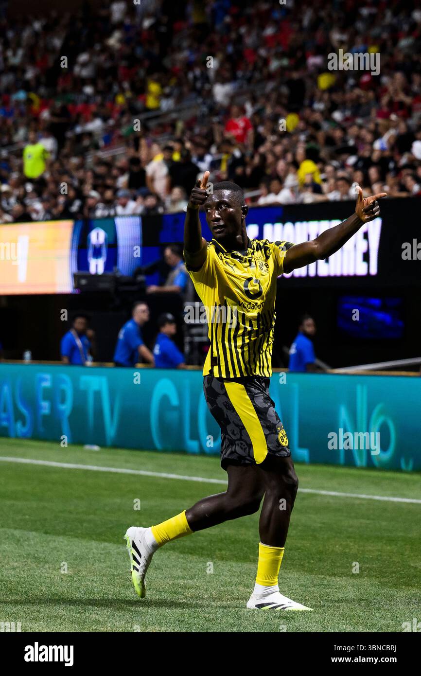 Serhou Guirassy of Borussia Dortmund celebrates after scoring a goal ...