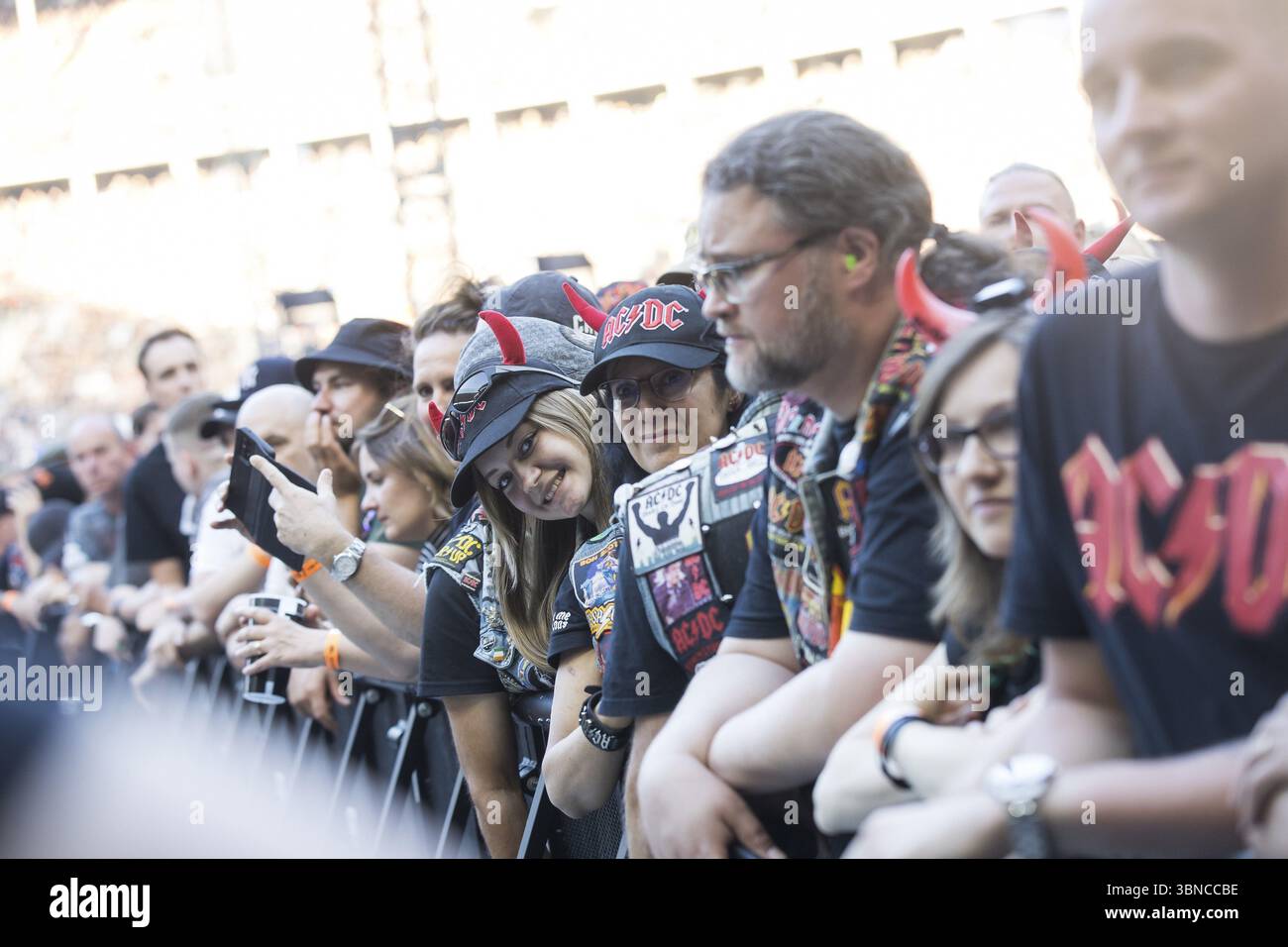 Fans in the front row in front of the concert of AC/DC live on Power Up ...