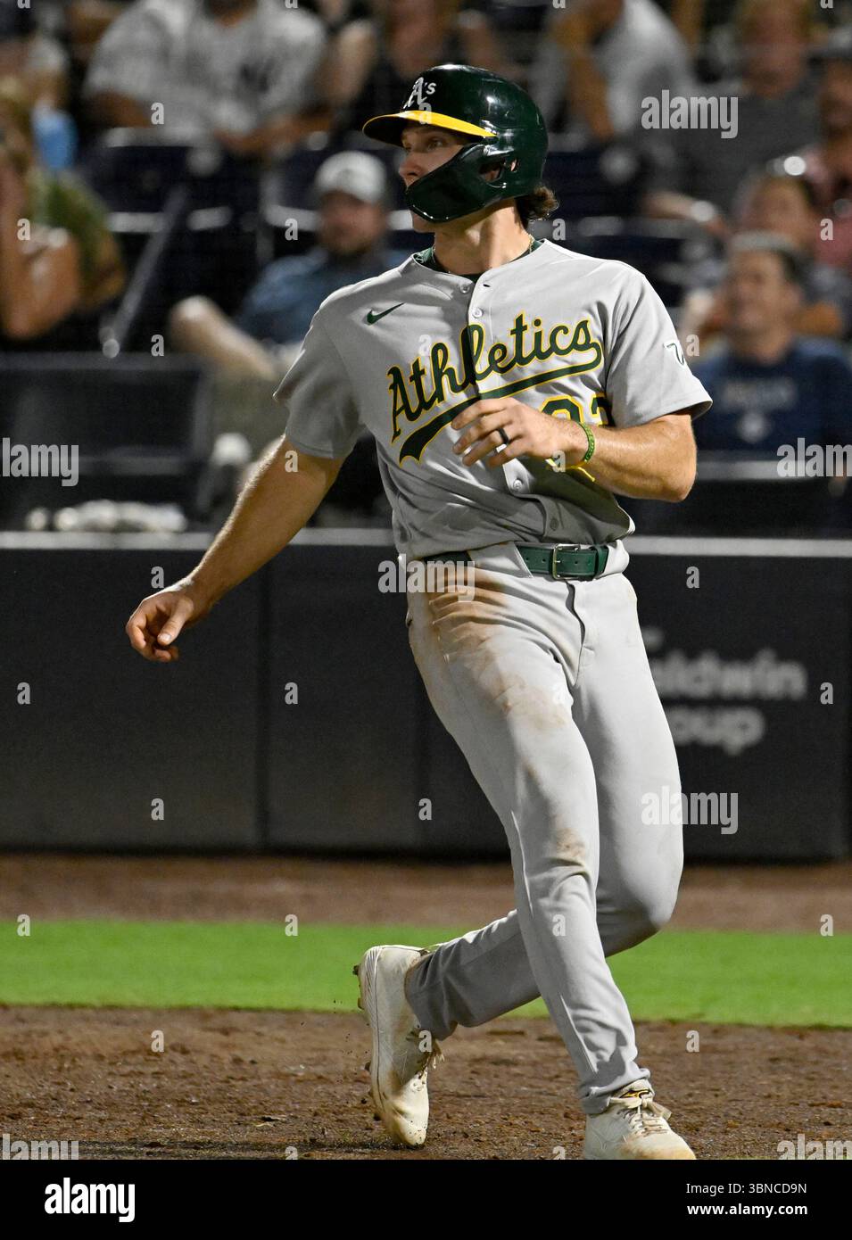 Athletics' Colby Thomas scores on a sacrifice fly by Austin Wynns, not ...