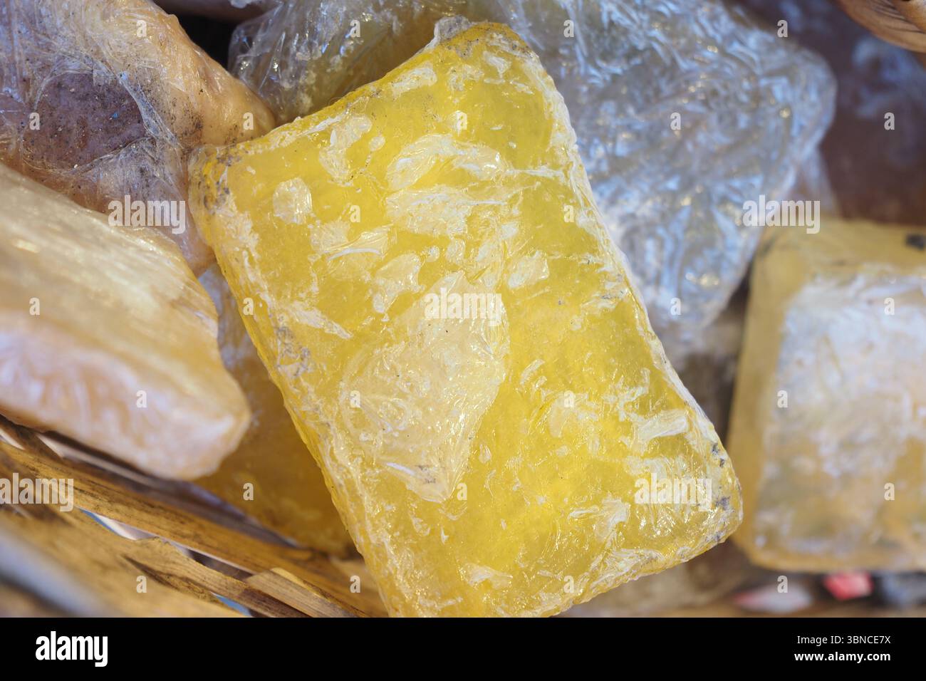 Natural yellow soaps displayed in a woven basket Stock Photo - Alamy