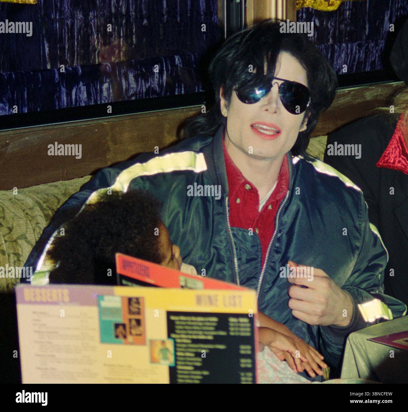 Michael Jackson holding a one year old girl, Juelle Dixson (whose ...