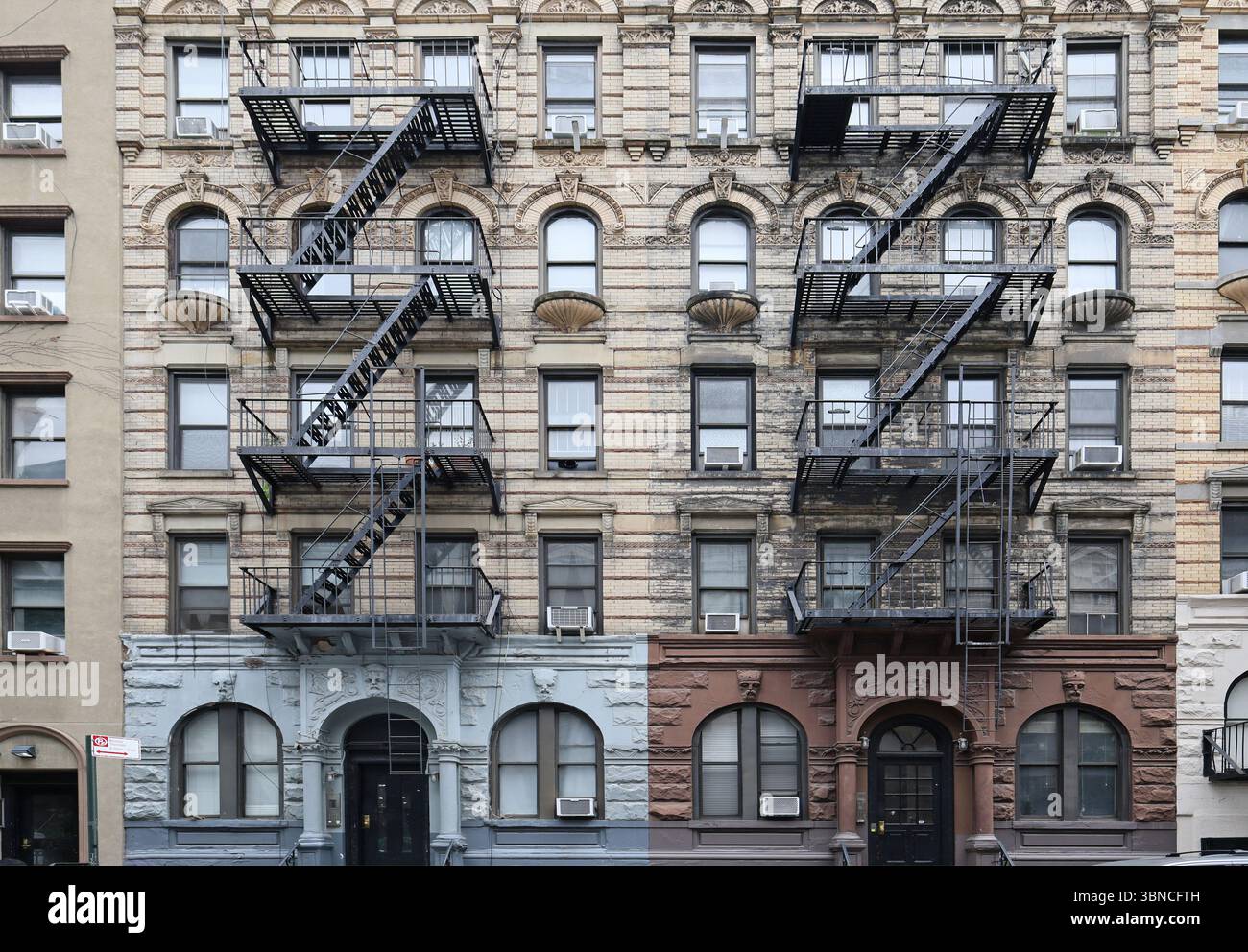 Old New York apartment building with curved ornamentation above windows ...