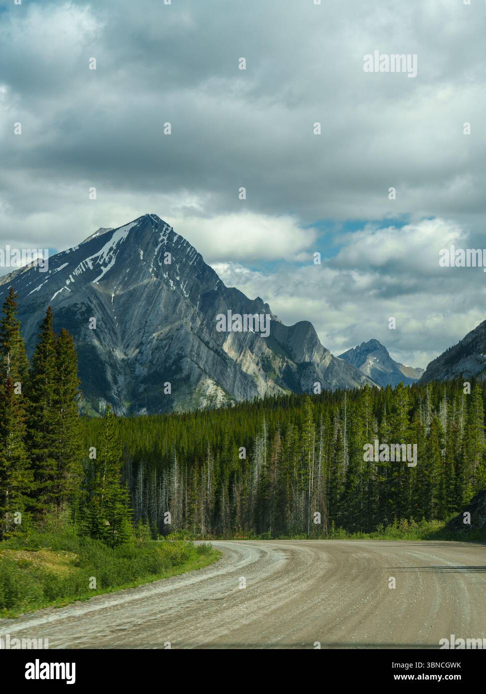 Mountain landscape with gravel road near Peter Lougheed Provincial Park ...