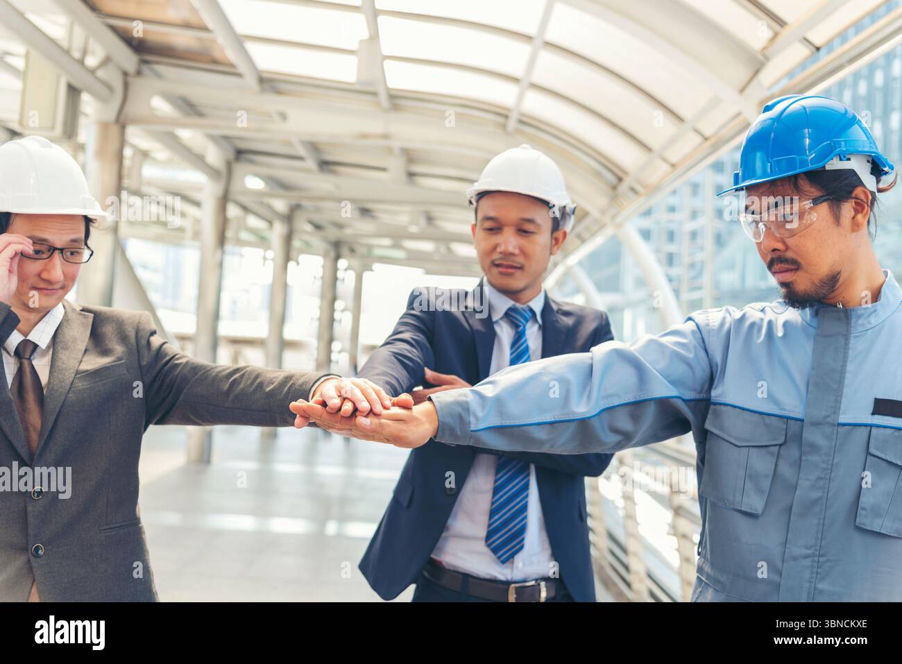 Civil engineer teams meeting working together wear worker helmets ...