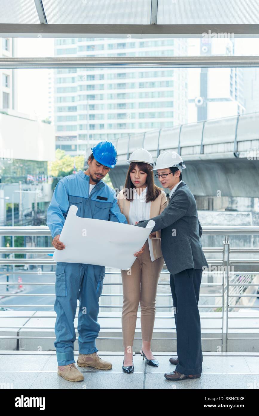 Civil engineer teams meeting working together wear worker helmets ...
