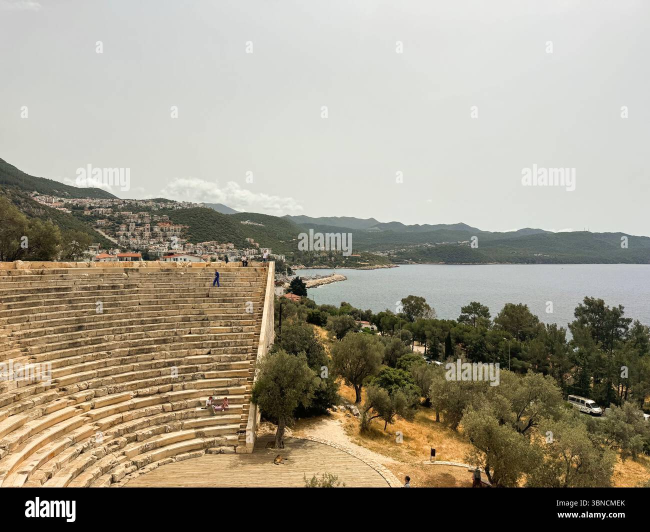 Ancient theater overlooking the beautiful coastline near a small town ...