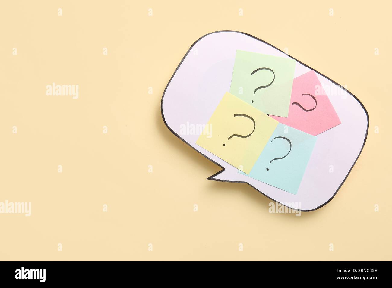 Speech bubble with question marks on color background Stock Photo - Alamy