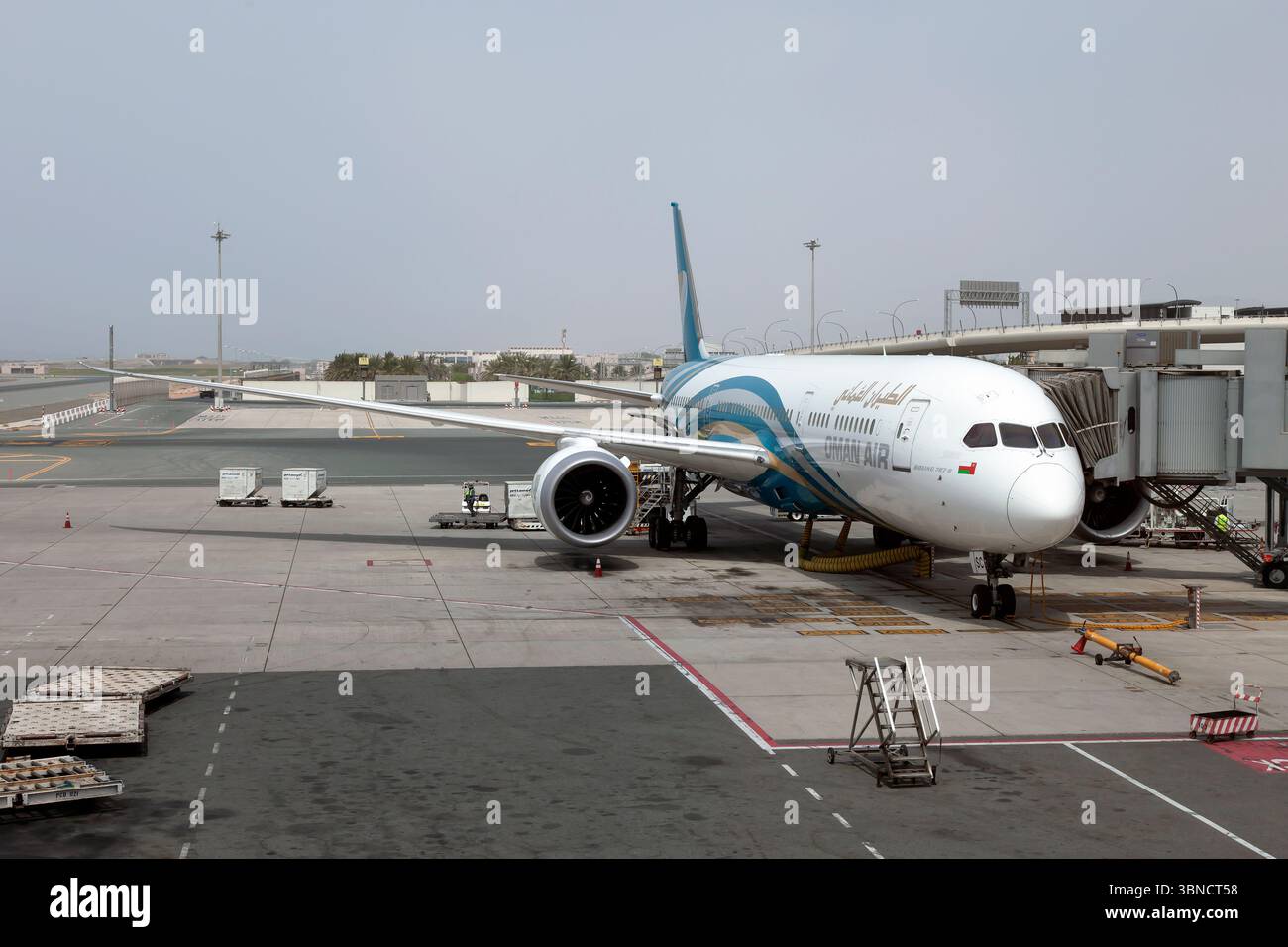 An Oman Air Boeing 787-9 Dreamliner waits to welcome its passengers at ...