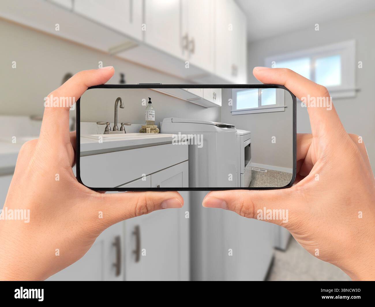 Modern residential laundry room with cell phone Stock Photo - Alamy