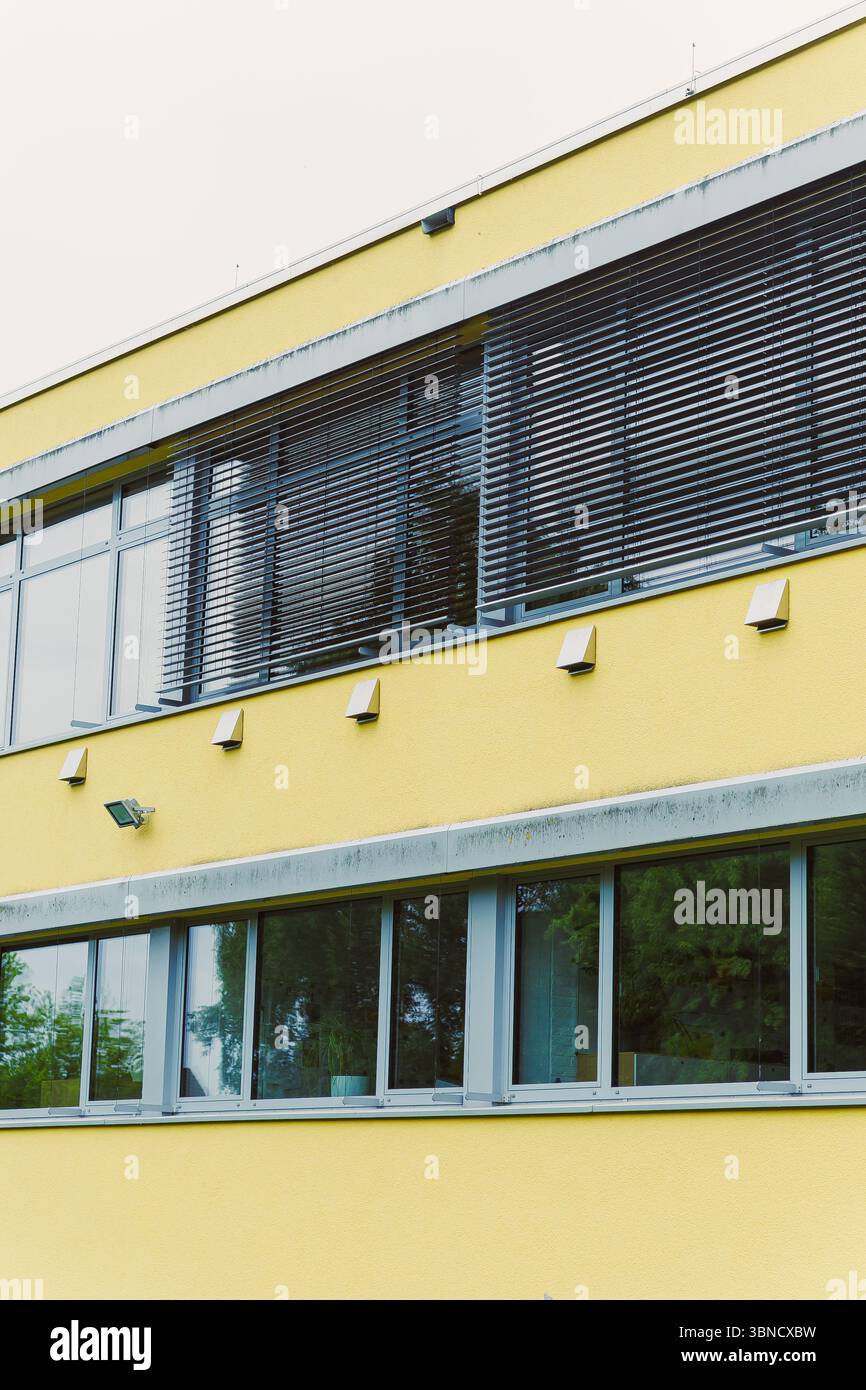 Explore the vibrant yellow building with its striking modern design ...