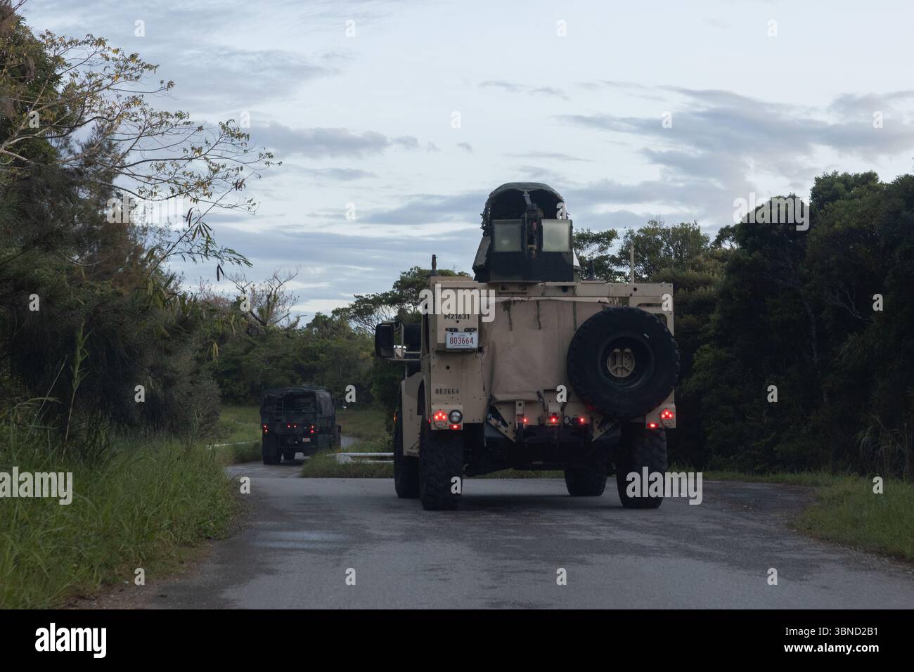 A U.S. Marine Corps Joint Light Tactical Vehicle provides rearward ...