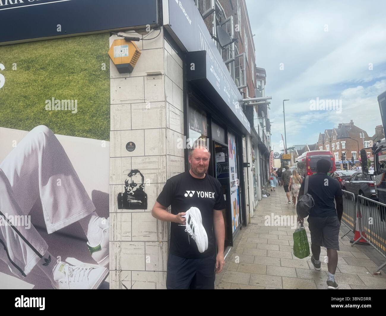 Darren Powell, manager of Wimbledon Park Sports in London, holding a ...